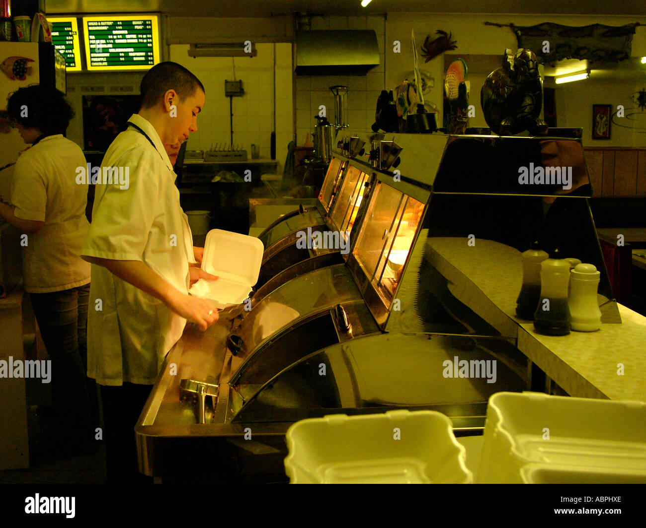 Man in fish and chip shop hi-res stock photography and images - Alamy