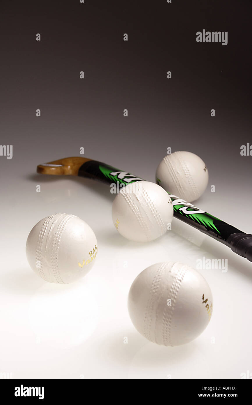 VDA78926 Hockey balls four white color and stick Stock Photo - Alamy