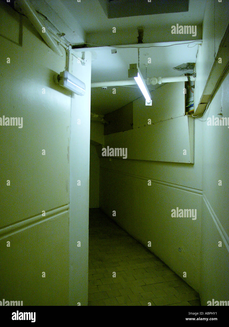 Fluorescent light glowing in an empty corridor Stock Photo - Alamy