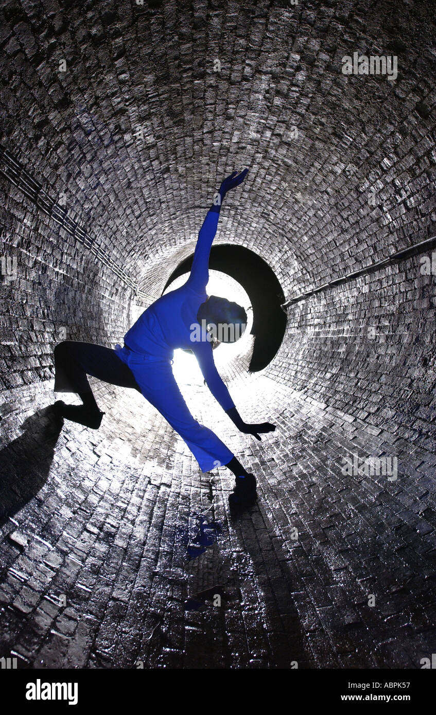 Underground movement dancer puts on a show in a subterranean sewer ...