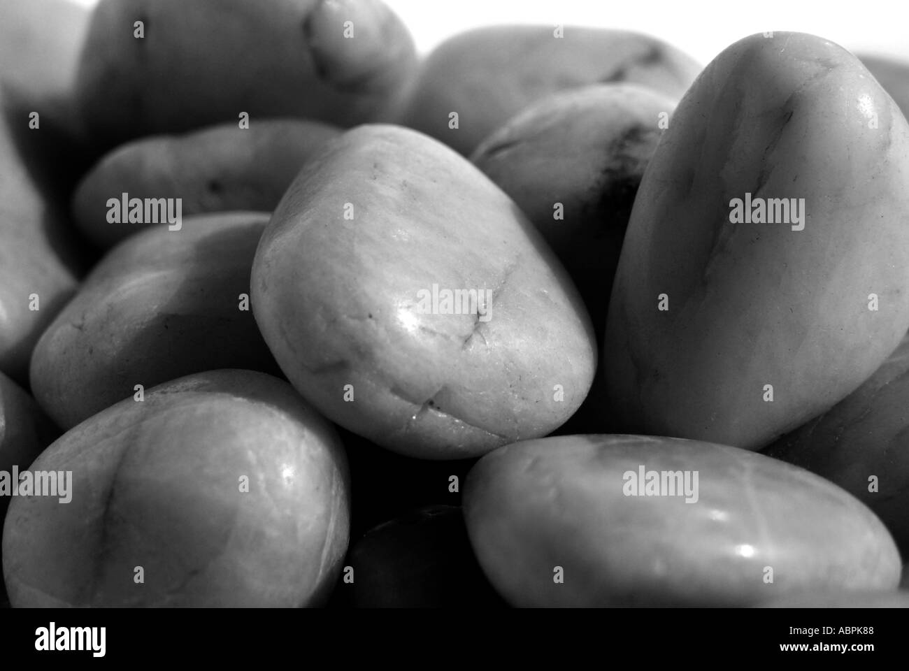 black and white shiny polished pebbles Stock Photo - Alamy
