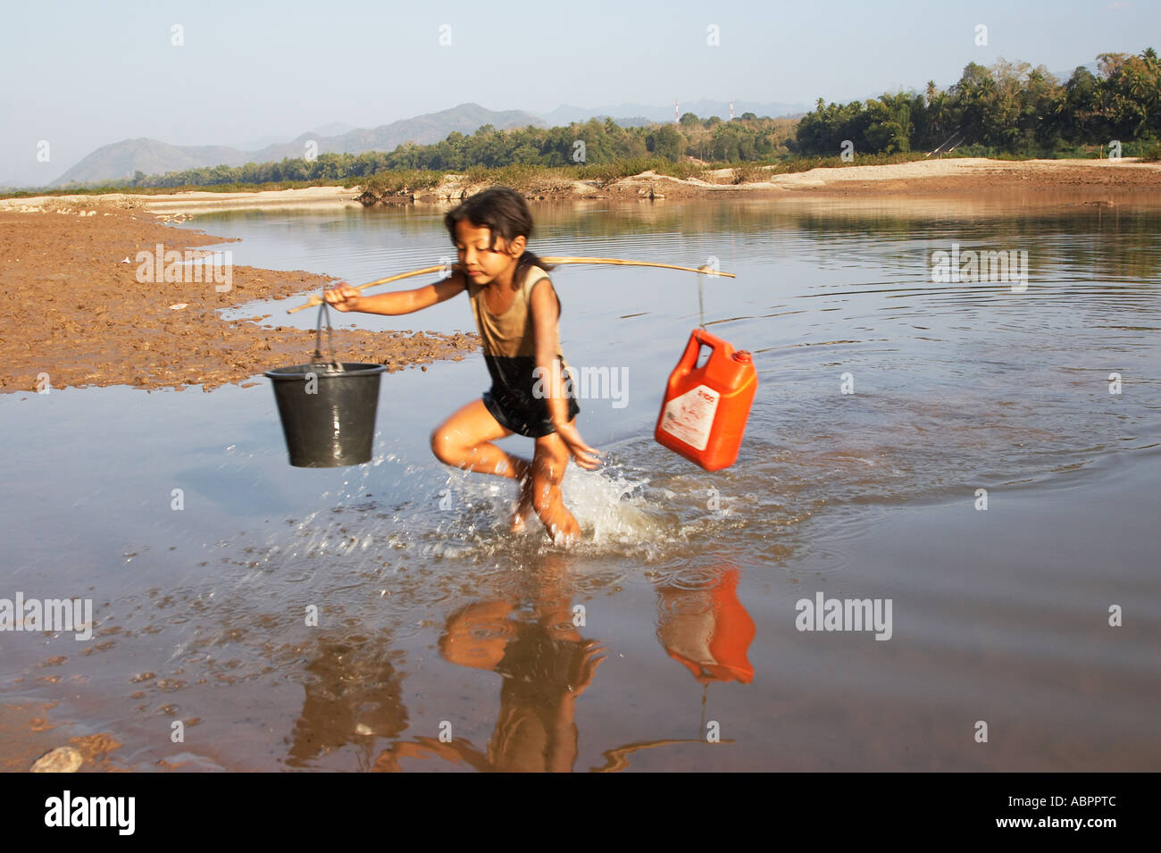 Girl Collecting Water From Mekong River Stock Photo - Alamy