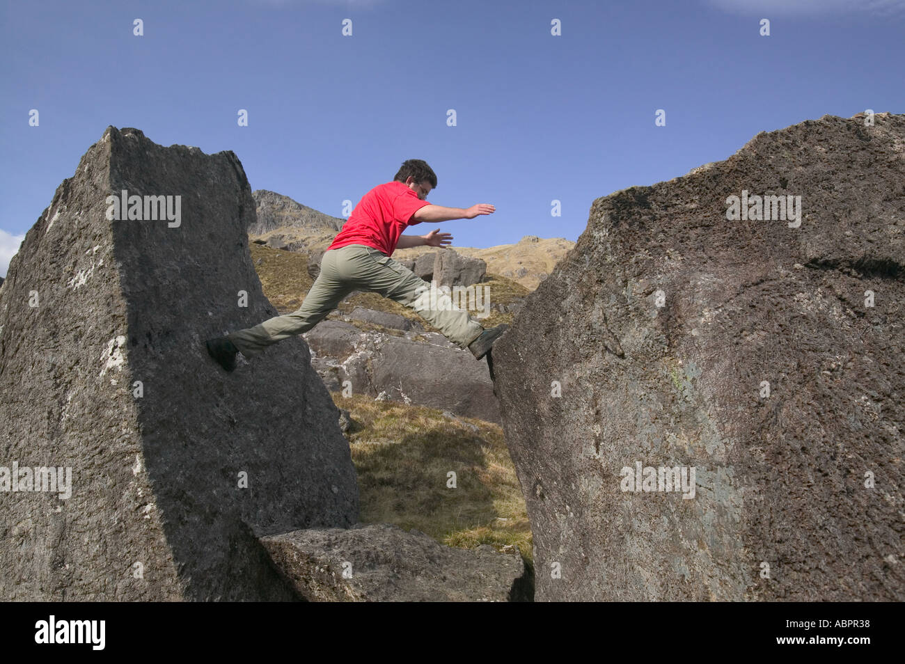 a climber bouldering beneath Ben Nevis Glen Nevis Scotland Stock Photo ...