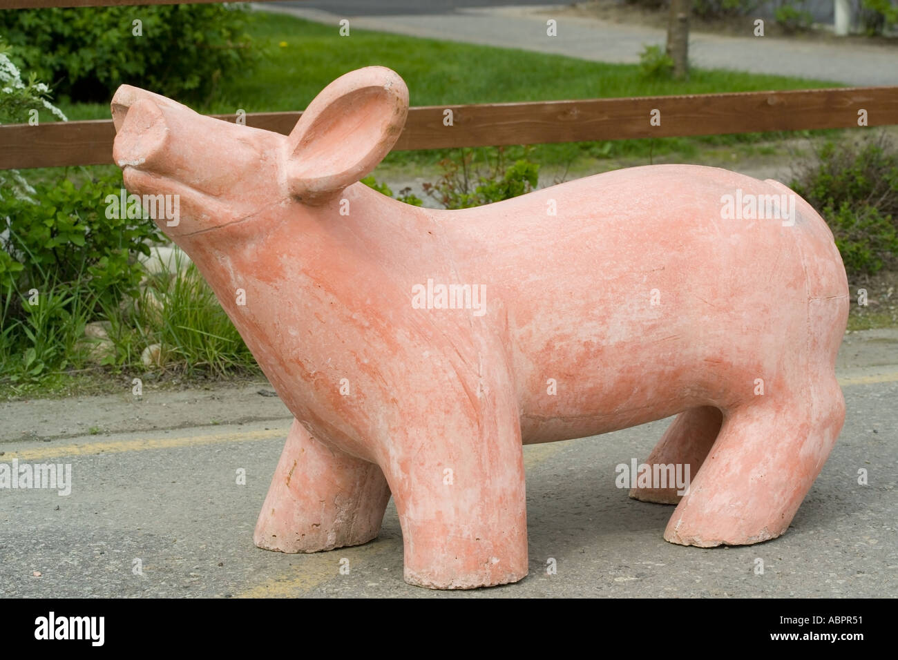 concrete pig as traffic obstacle in a no parking zone Stock Photo - Alamy
