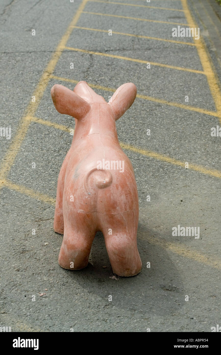 concrete pig as traffic obstacle in a no parking zone Stock Photo - Alamy