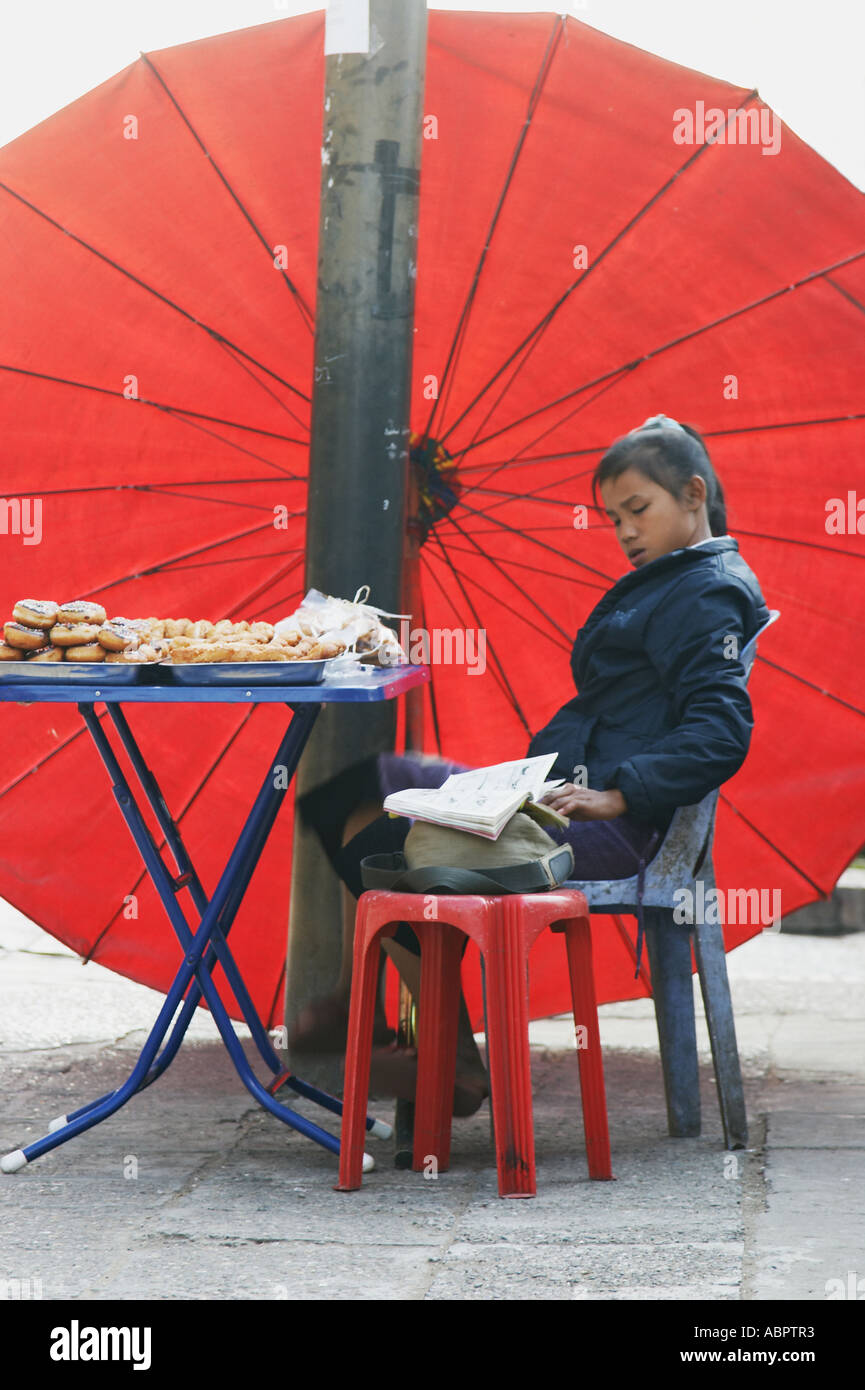 Girl Vendor Selling Cakes Stock Photo - Alamy