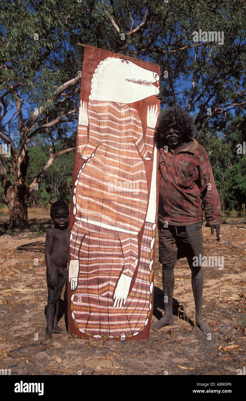 Aboriginal artist Jimmy Njiminuma with his bark painting of rainbow ...