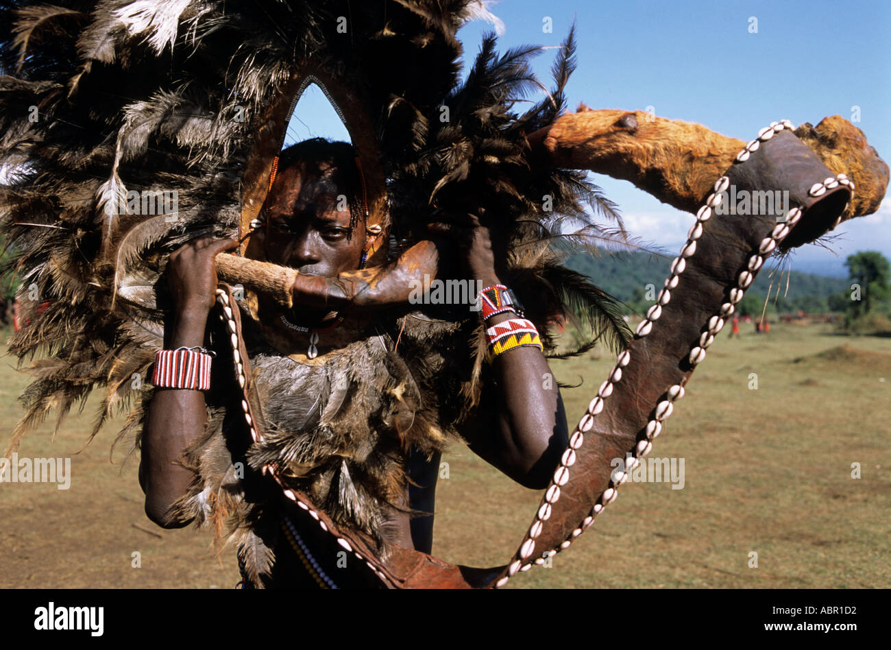 Lolgorian, Kenya. Siria Maasai Manyatta; moran 'lion head' with horn ...