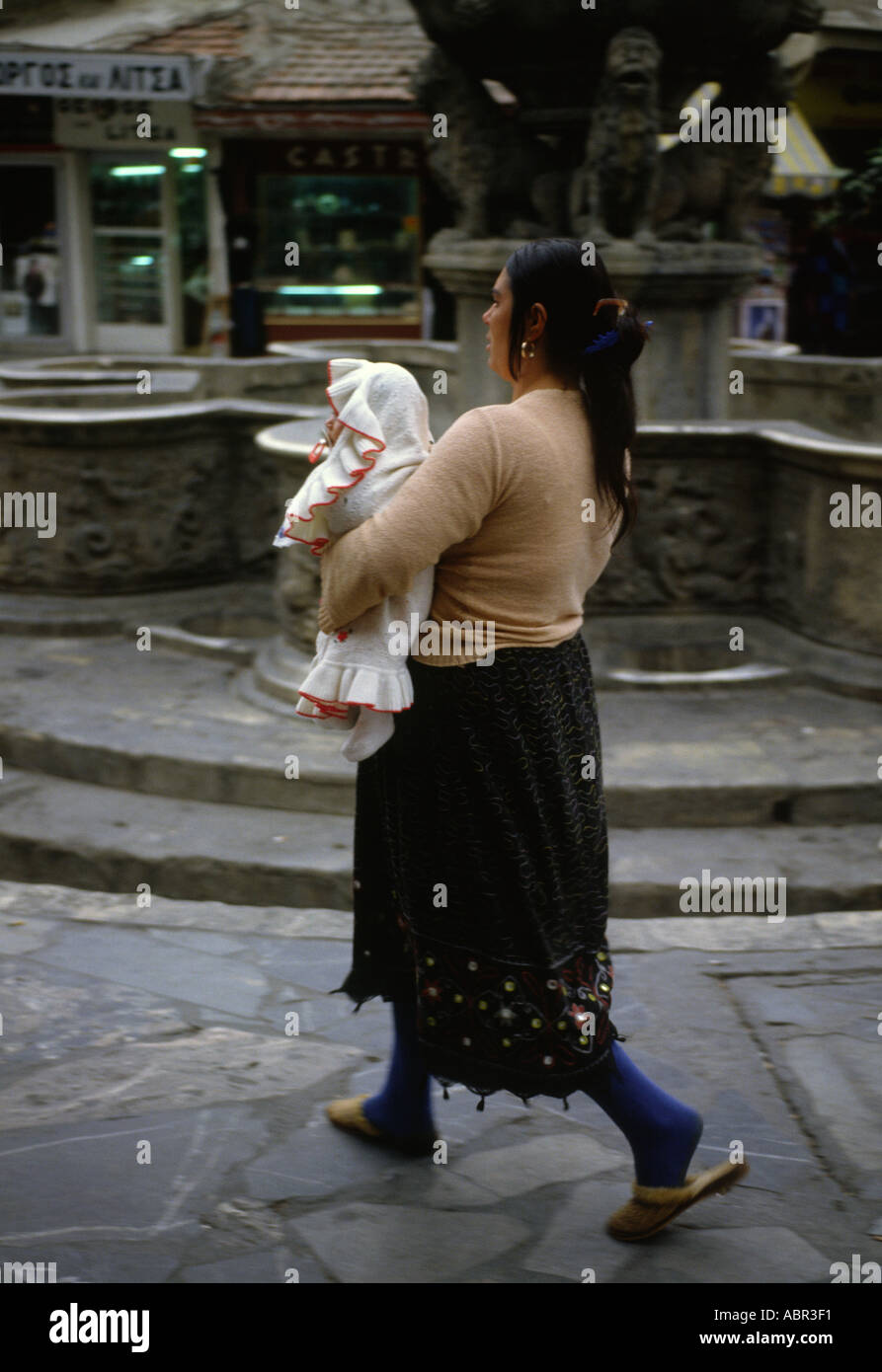 Woman carrying baby greece hi-res stock photography and images - Alamy