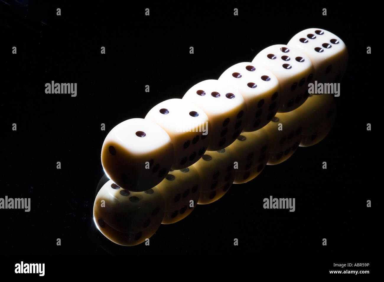 Dice in a row from one to six on a mirror - black background Stock ...