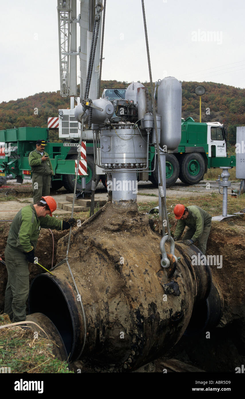 Lifting heavy pipe hi-res stock photography and images - Alamy