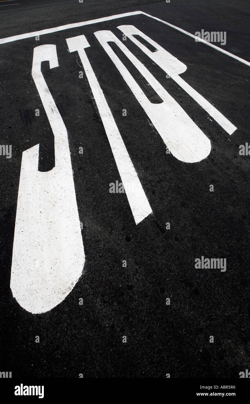 Stop sign painted on road Stock Photo - Alamy