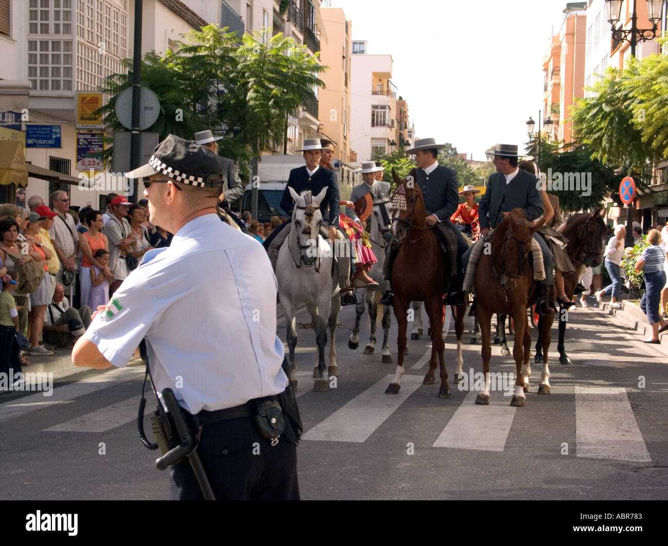 Spanish Policemen controlling Riders at a Zebra Crossing at the Feria ...