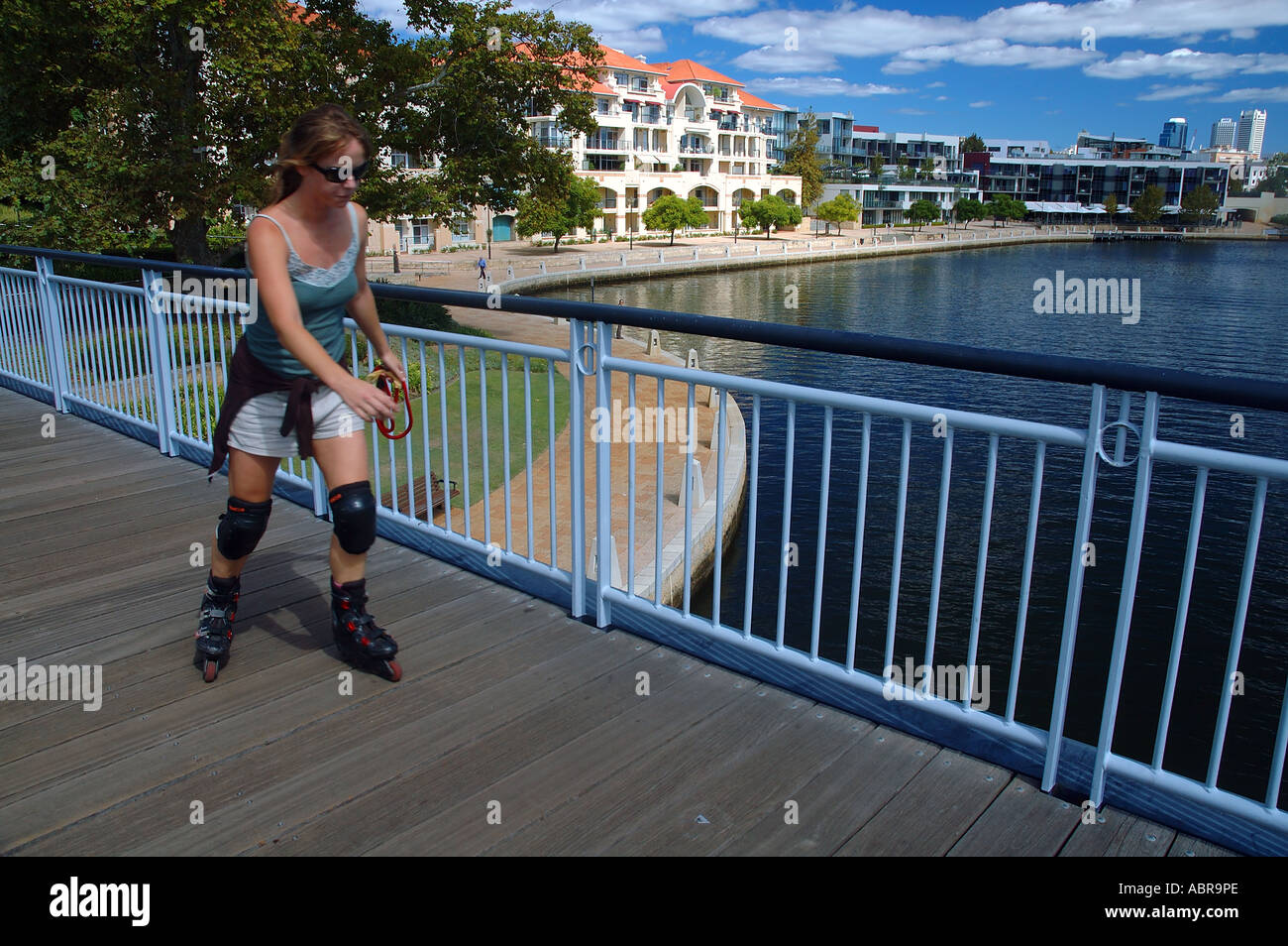Woman rollerblading across bridge in new designer suburb of East Perth ...
