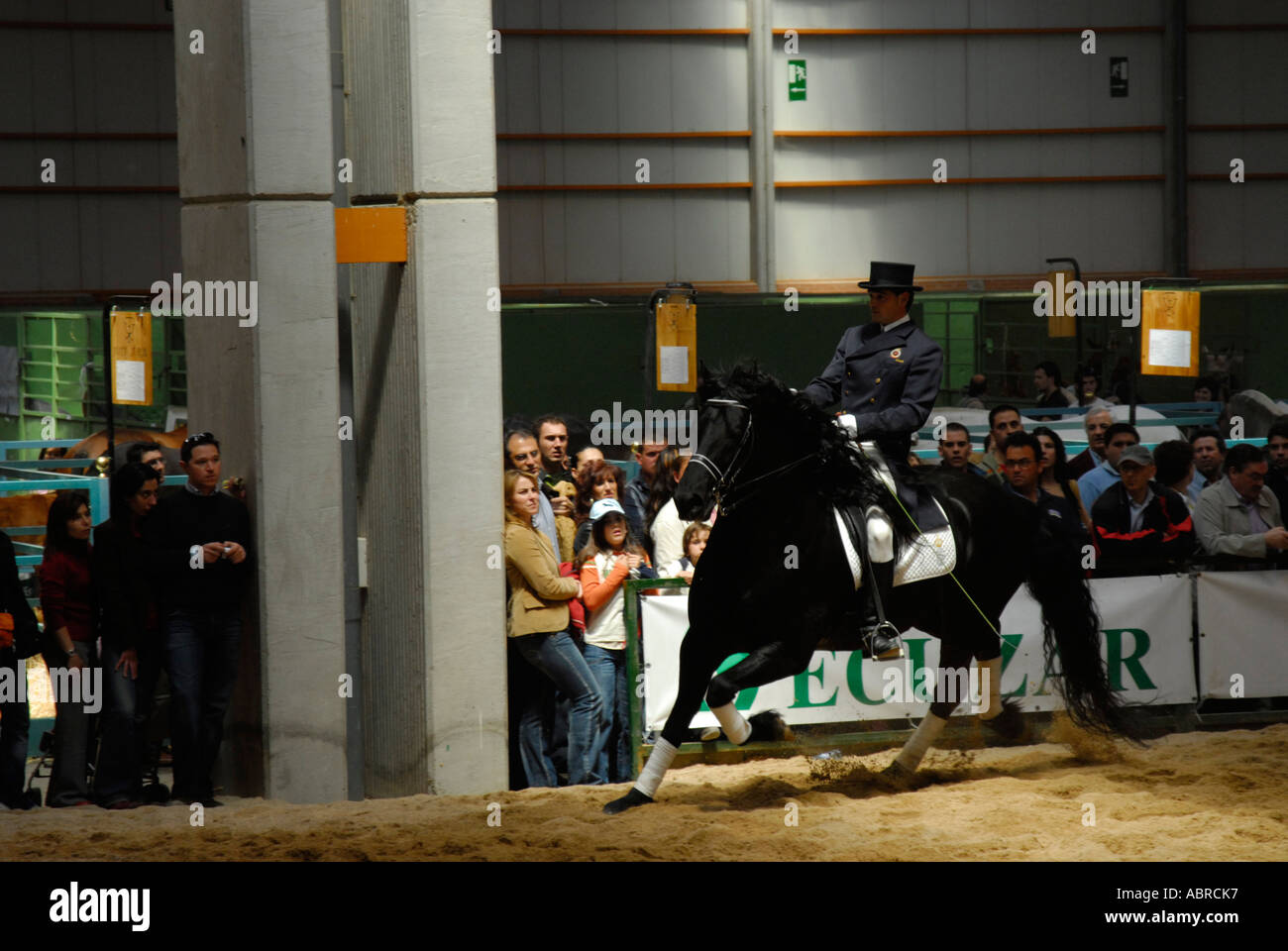Spanish rider in top hat and fancy wear showing form at agricultural ...