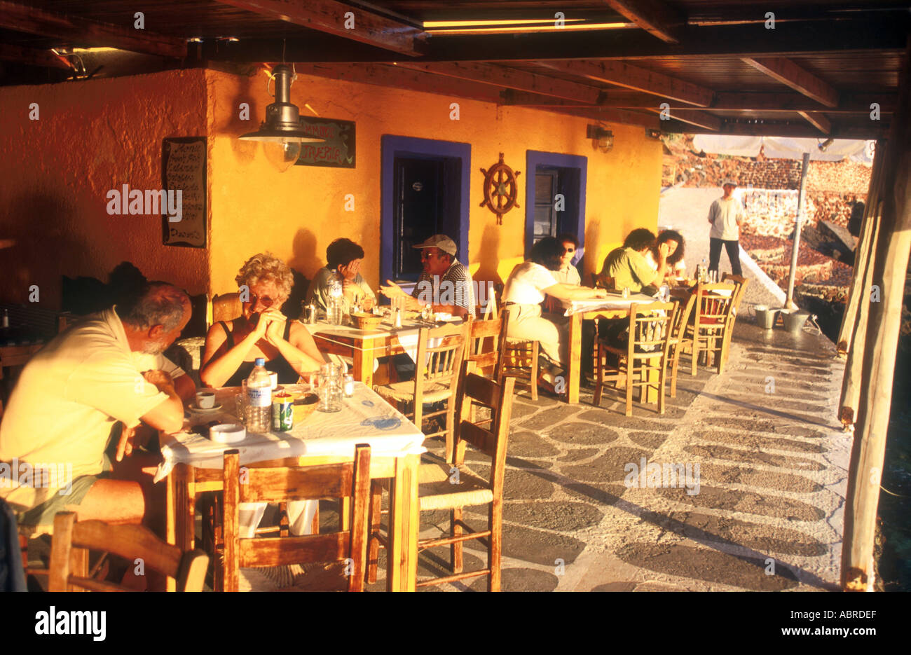 Santorini sunset people eating hi-res stock photography and images - Alamy