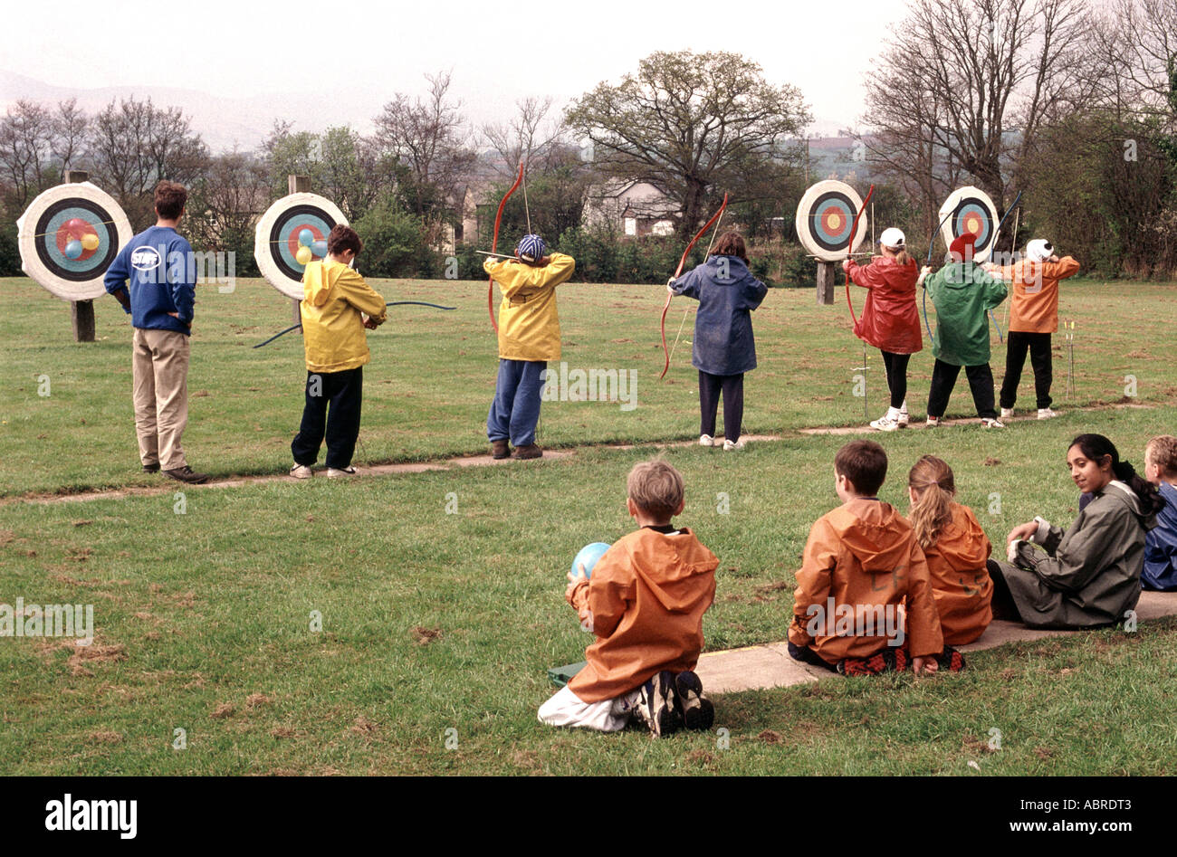 children practiciing archery Stock Photo - Alamy