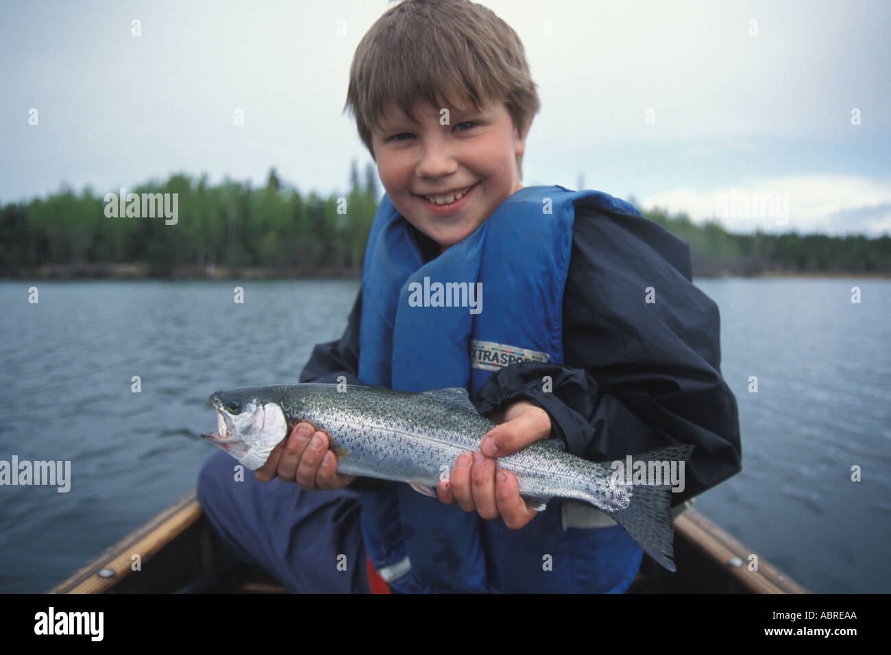 Boy with Rainbow trout Swanson Lakes Canoe Trail Kenai Peninsula Alaska ...