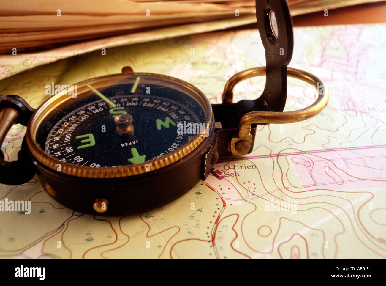 Antique brass compass and map Stock Photo - Alamy