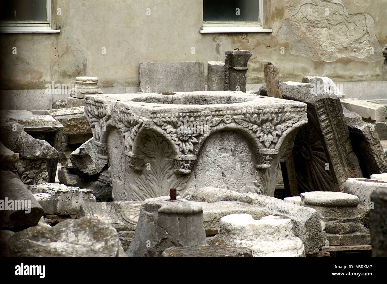 Ancient font? In scrap yard behind church of St Chrysogonus Stock Photo ...