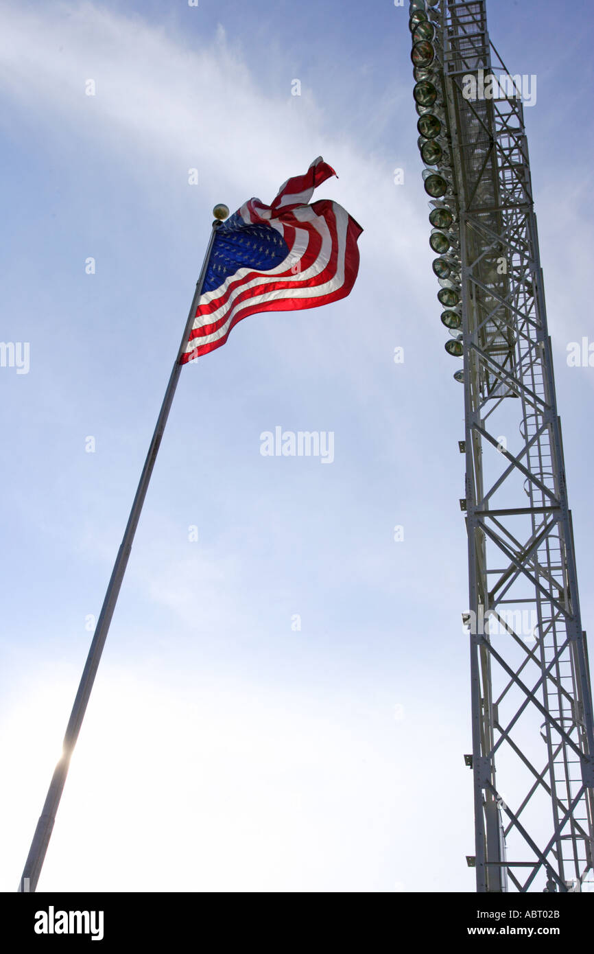 Flag and light tower at a stadium Stock Photo - Alamy