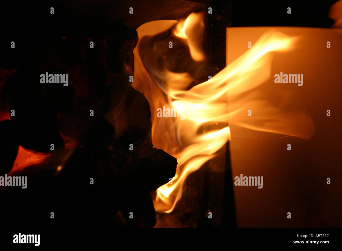 Burning piece of paper Stock Photo - Alamy