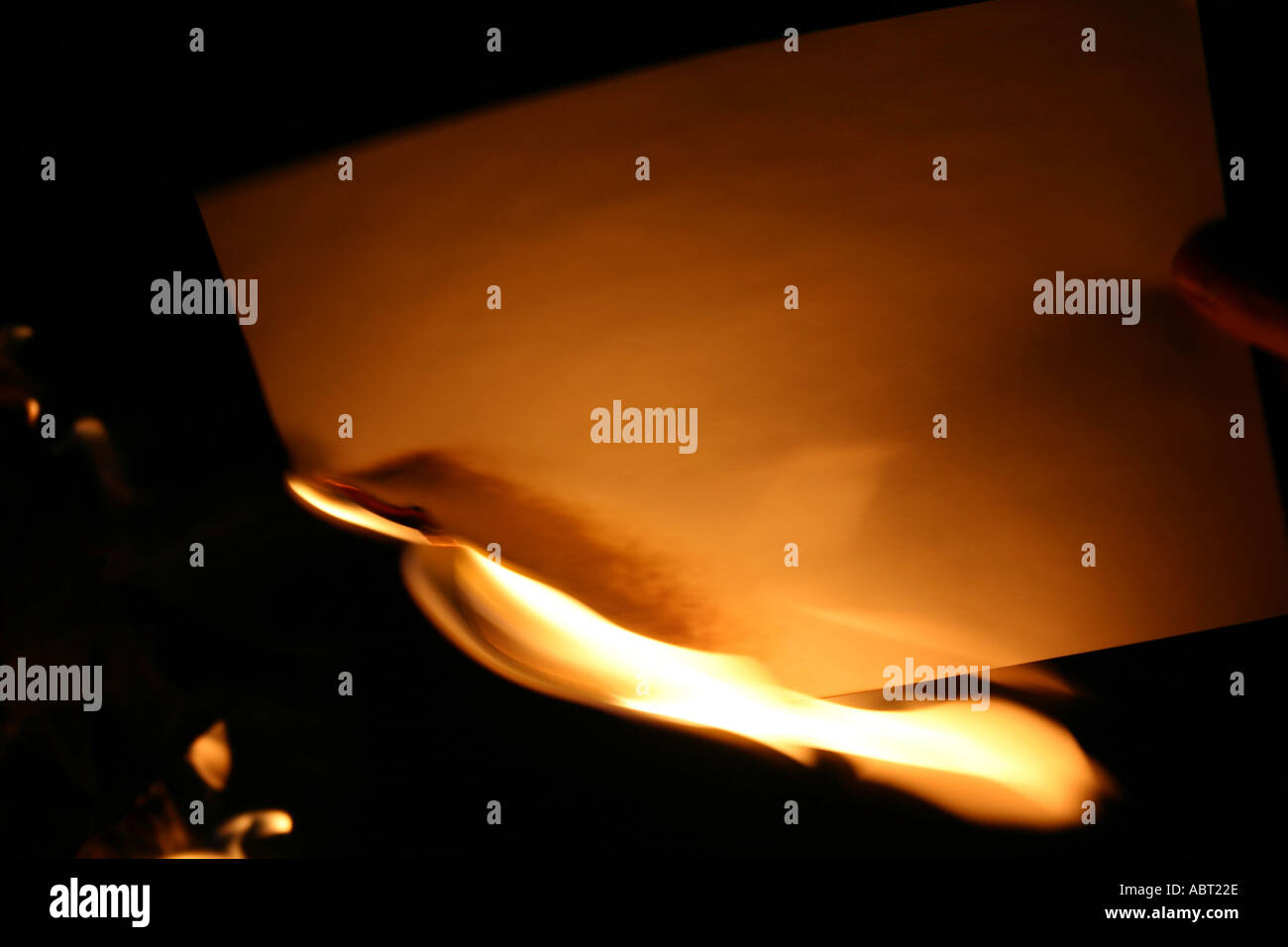 Burning piece of paper Stock Photo - Alamy