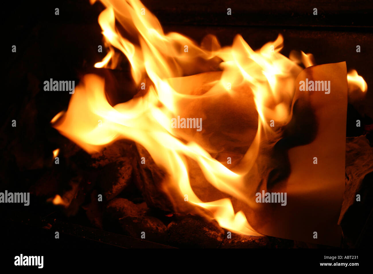 Burning piece of paper Stock Photo - Alamy