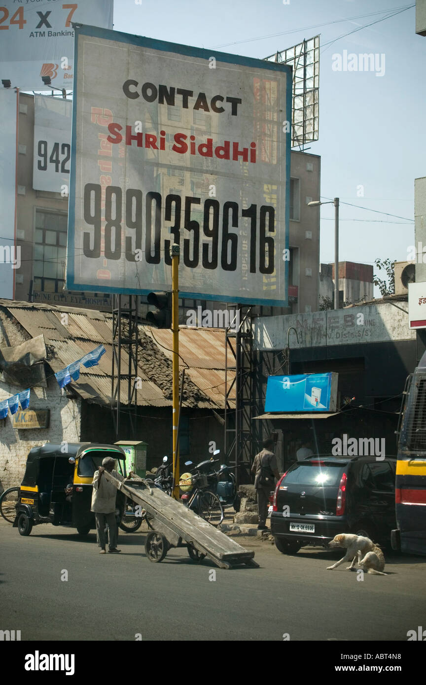 A billboard advertising a mobile phone telephone number for anyone ...