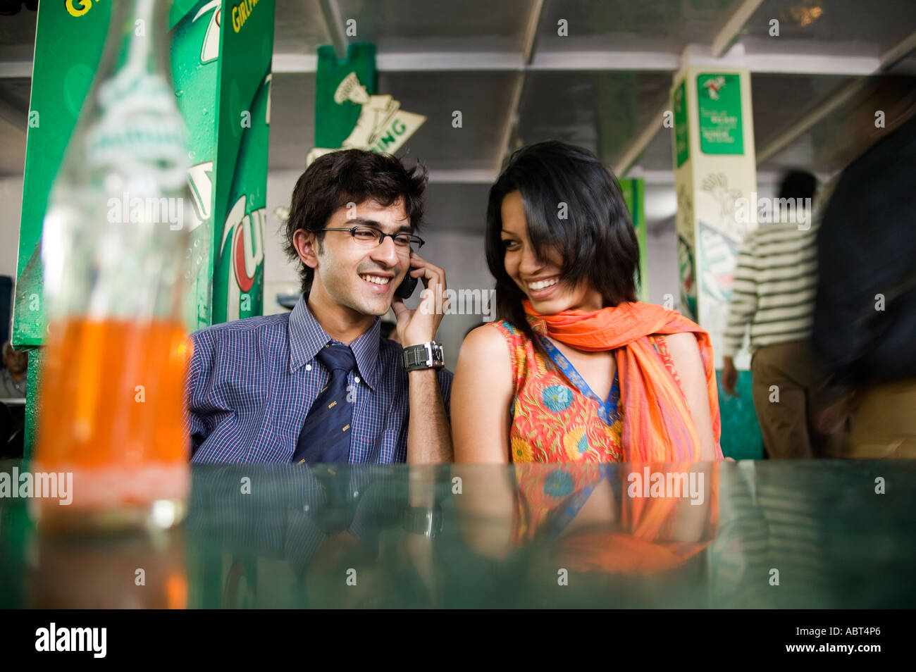 Wealthy Indian students using a mobile phone in the college refectory ...