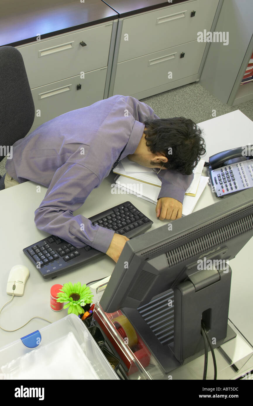 Person Slumped At Their Desk High Resolution Stock Photography and ...
