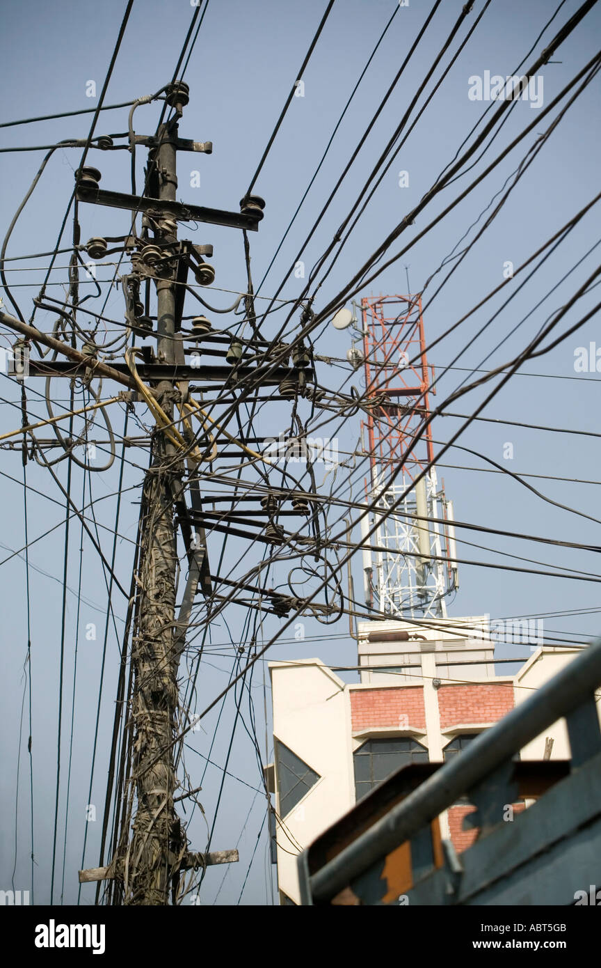 Old telephone cables juxtaposed against a mobile phone mast Delhi India ...