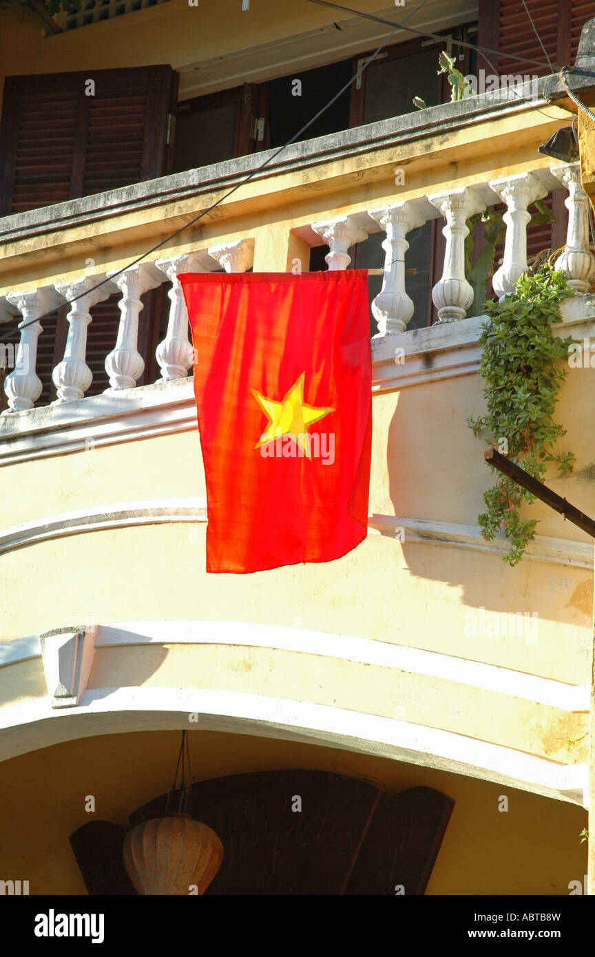 The Vietnamese flag hangs from a balcony in Hoi An Old Town on the ...