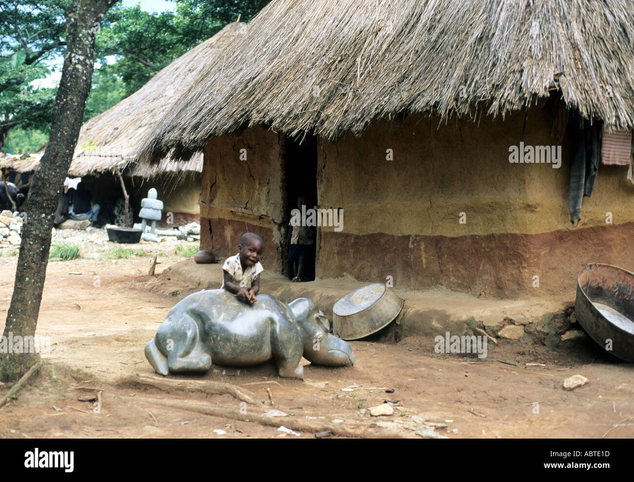 Child on Hippo sculpture Tengenenge artists community Zimbabwe Stock ...
