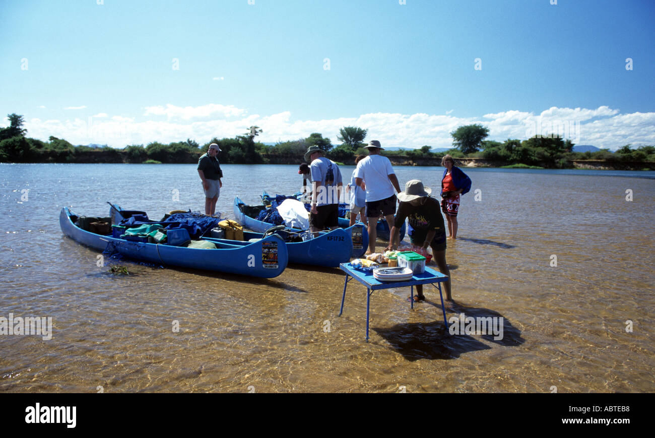 Lunch in shallow waters in the Zambezi on a canoe safari Stock Photo ...