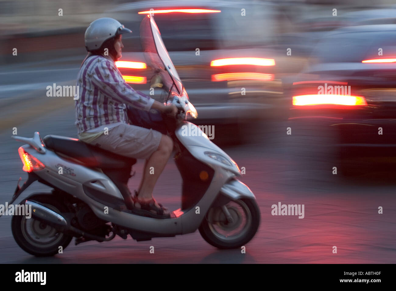 Scooter rider in slow motion hi-res stock photography and images - Alamy