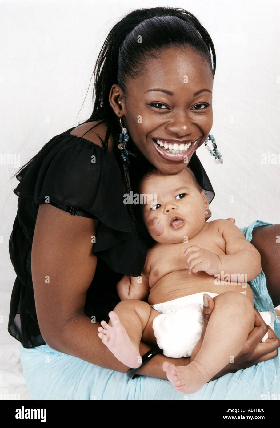 Baby girl playing coloured hi-res stock photography and images - Alamy