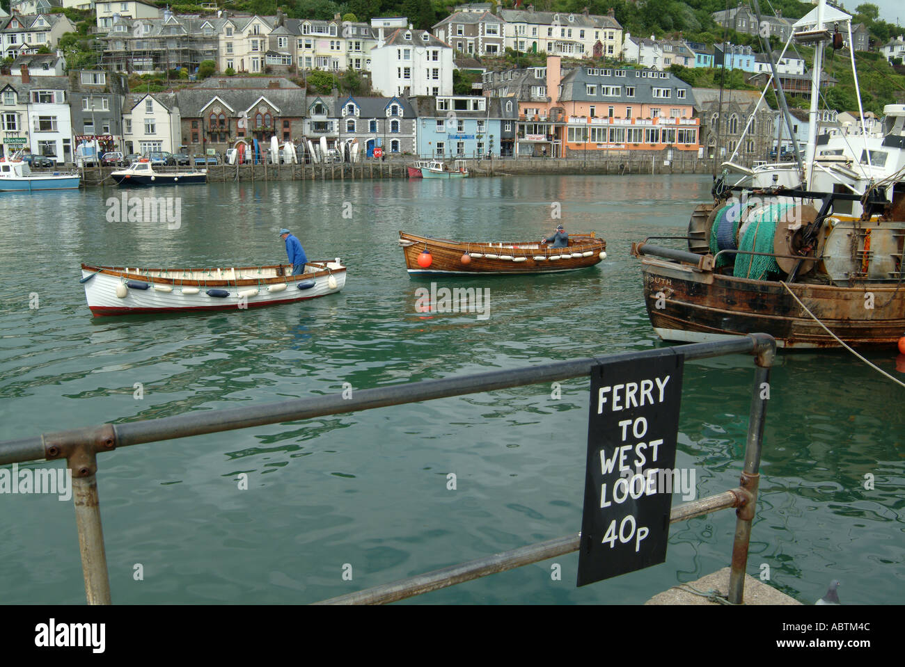 The Fishing Harbour Town of West Looe with Trawler and Small Ferry ...