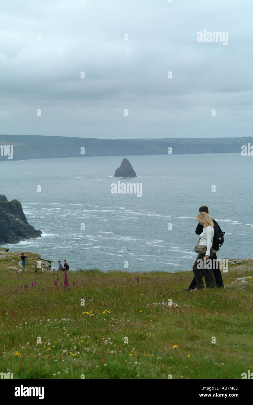 Young Couple Enjoying a Walk on Cliff Top at Tintagel Castle Cornwall ...