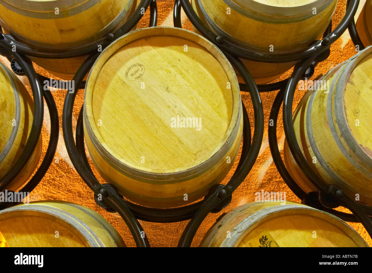 The barrel ageing cellar. The oak barriques are stacked in a steel ...