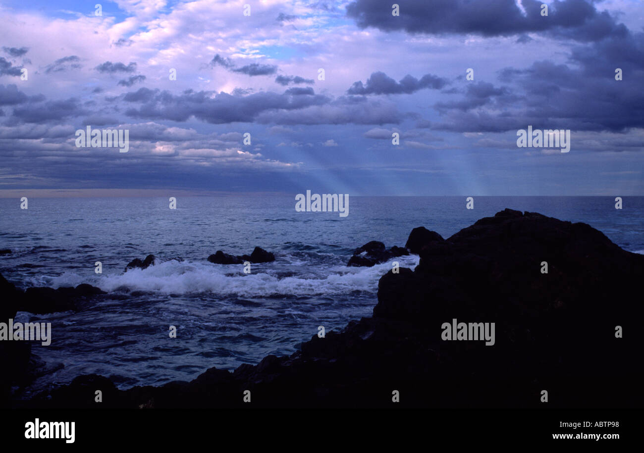 Clouds and beams of sunlight at sea Stock Photo - Alamy