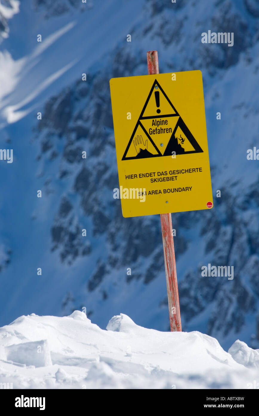 Signpost warning of danger at the top of the mountain Stock Photo - Alamy