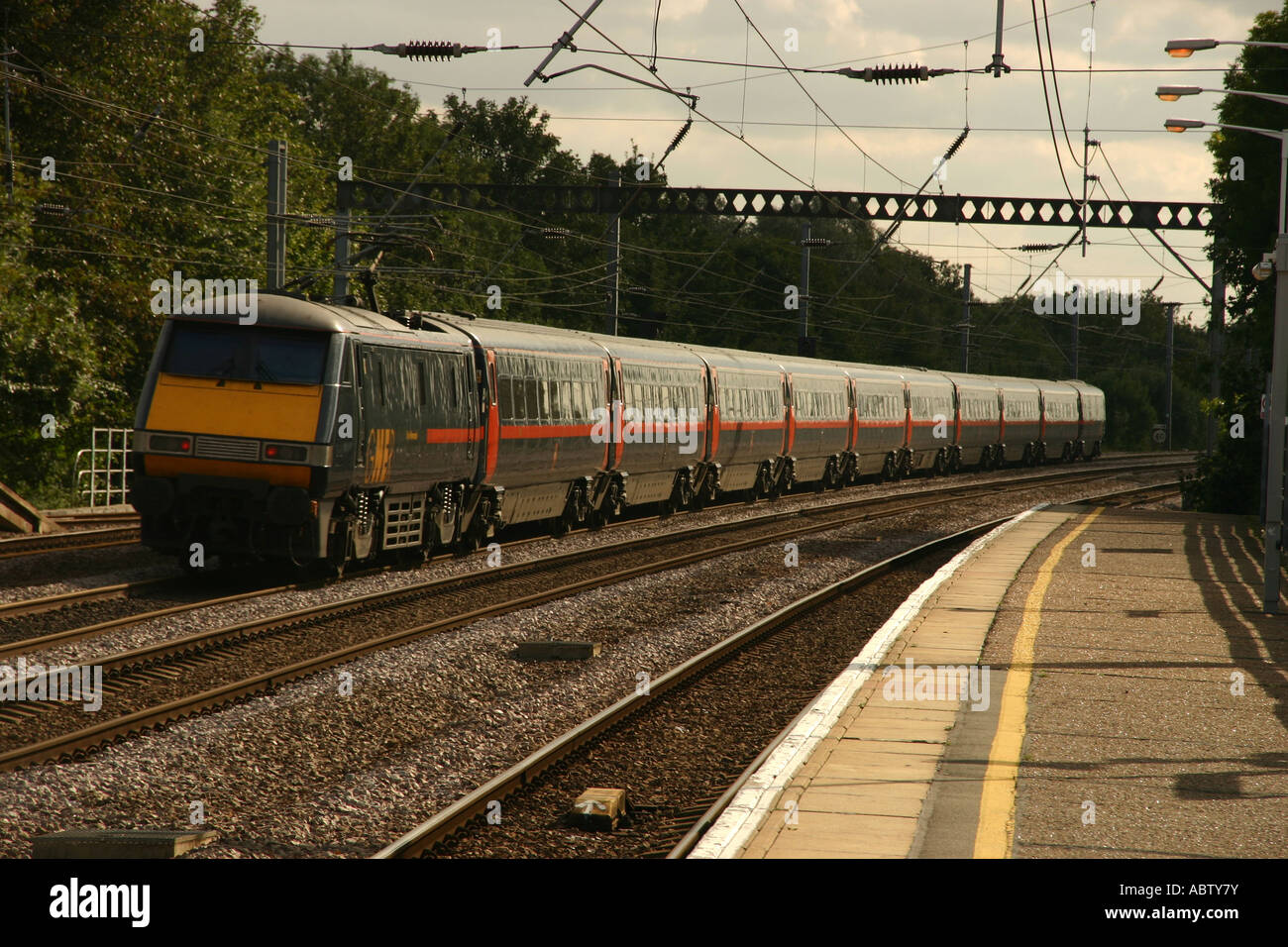 GNER Express Train Passes Through Huntindon Station at Speed Stock ...