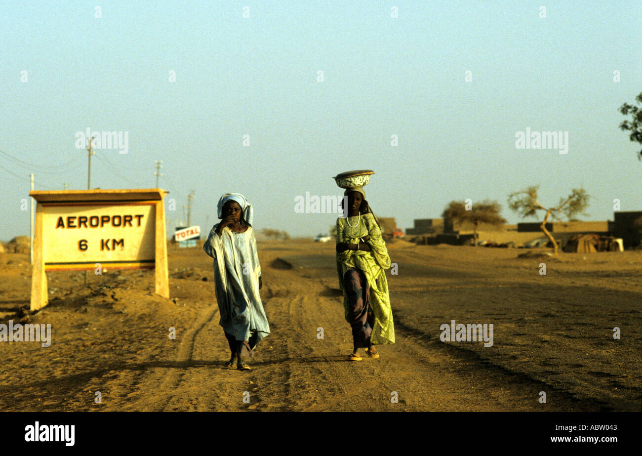 Women by airport sign Bamako Mali Stock Photo - Alamy