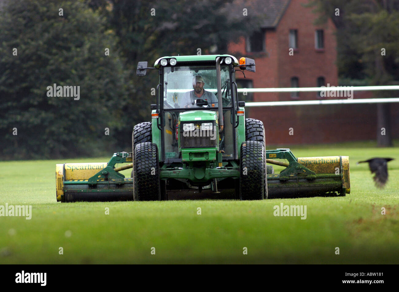 Tractor mower cutting grass Stock Photo - Alamy
