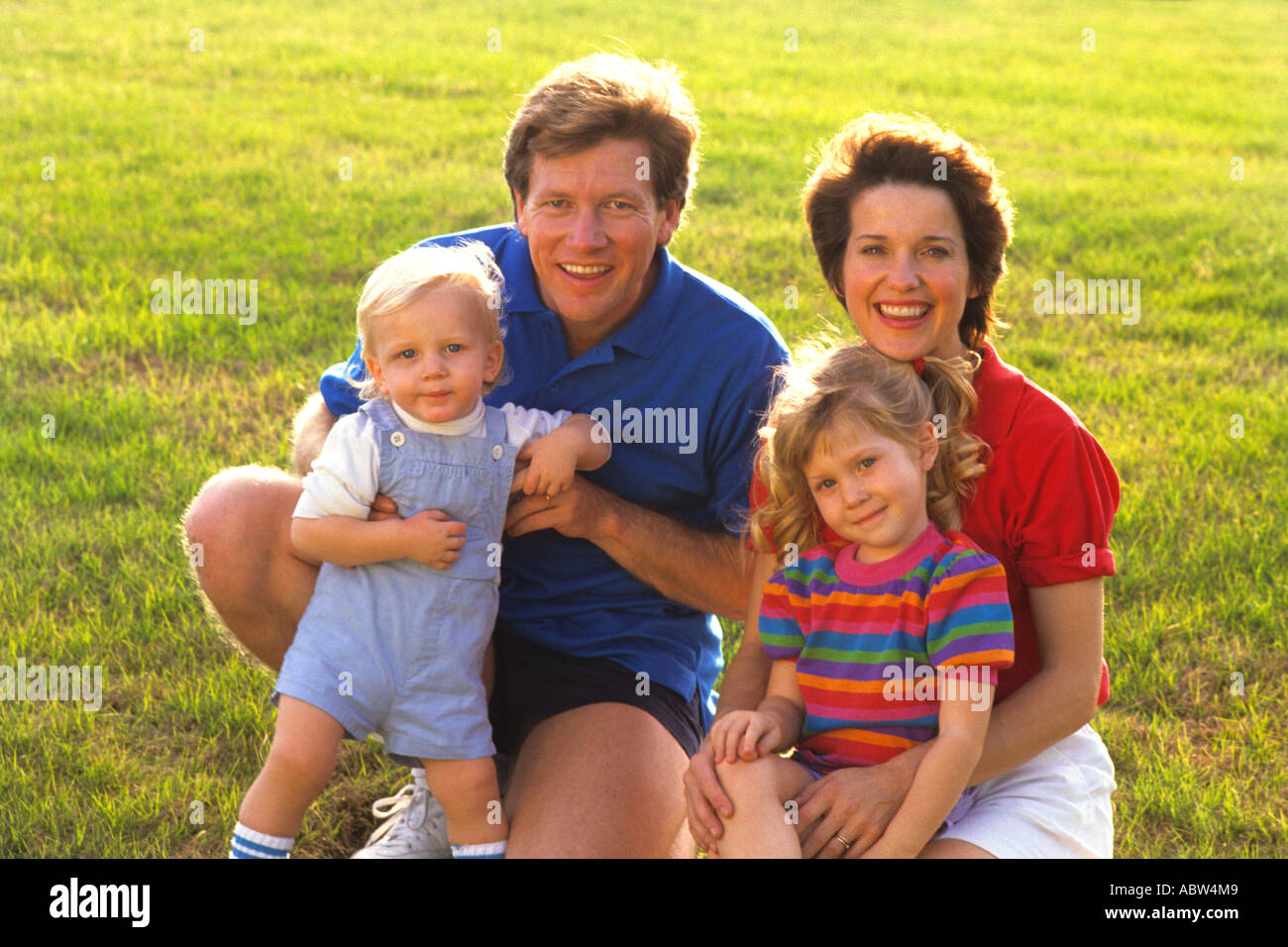 Family with small children spending quality time together having fun ...