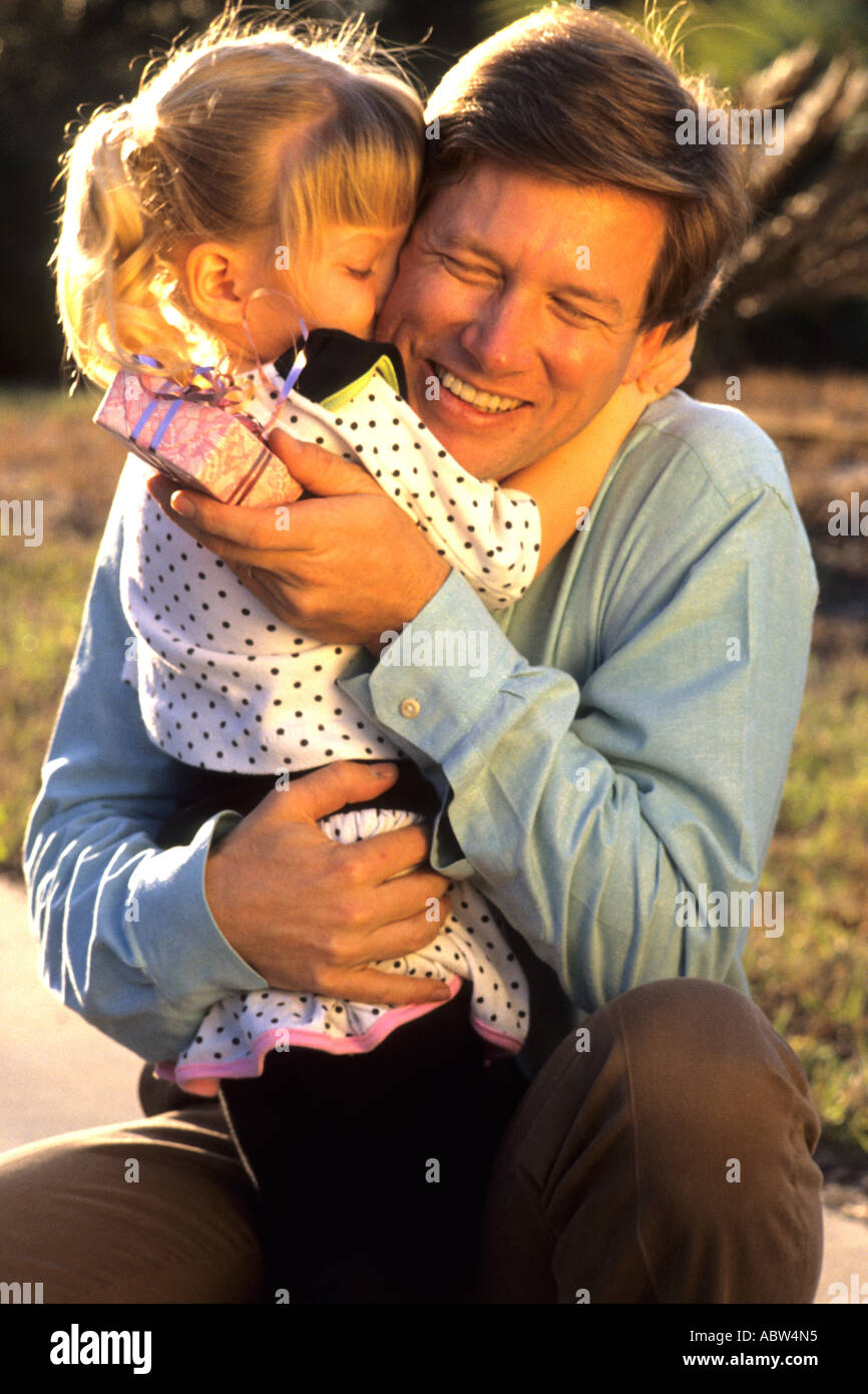 Father gets a great hug from his daughter after getting a surprise gift ...