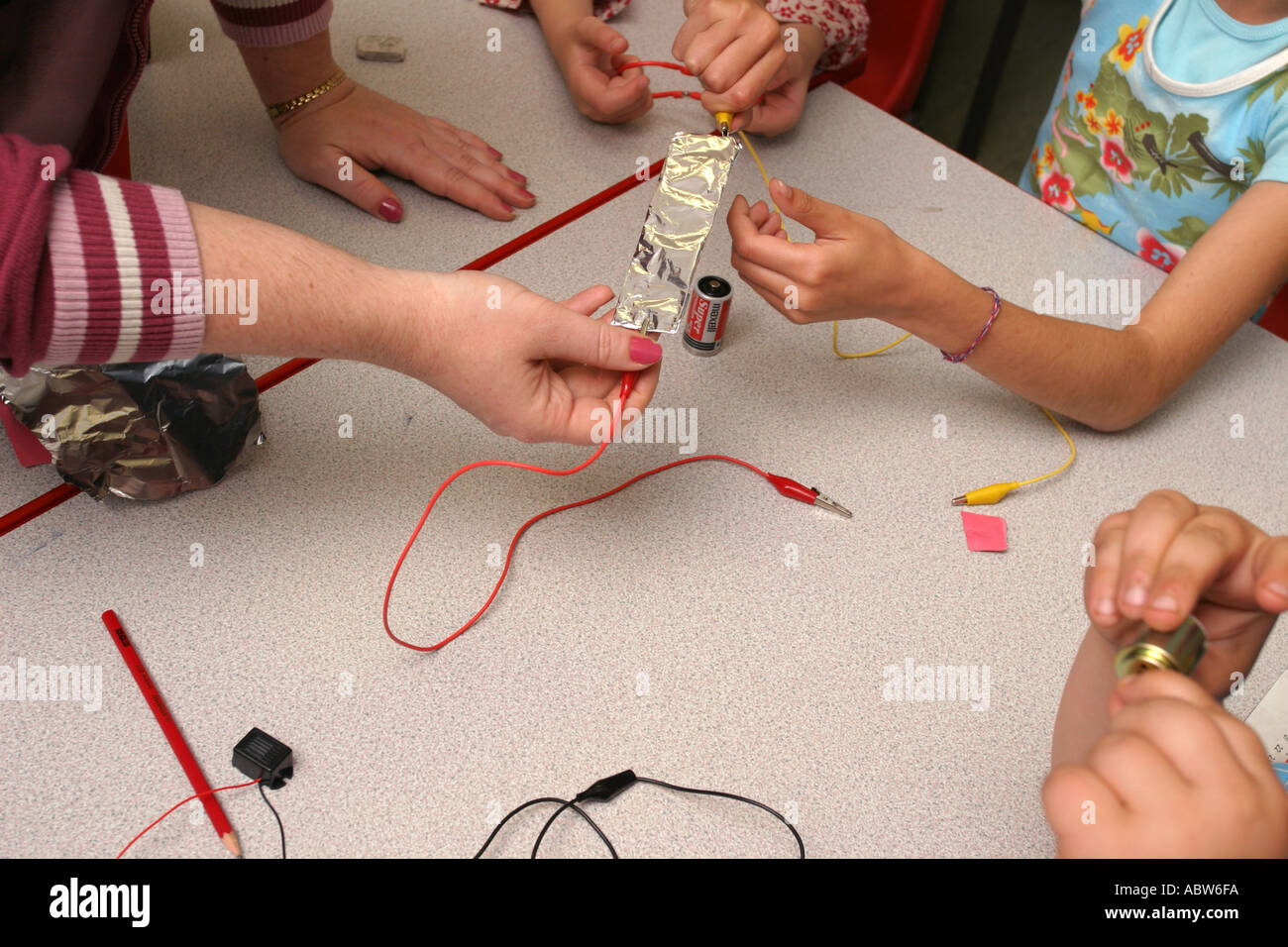 Pupils at work in class during a science lesson at their Junior school ...