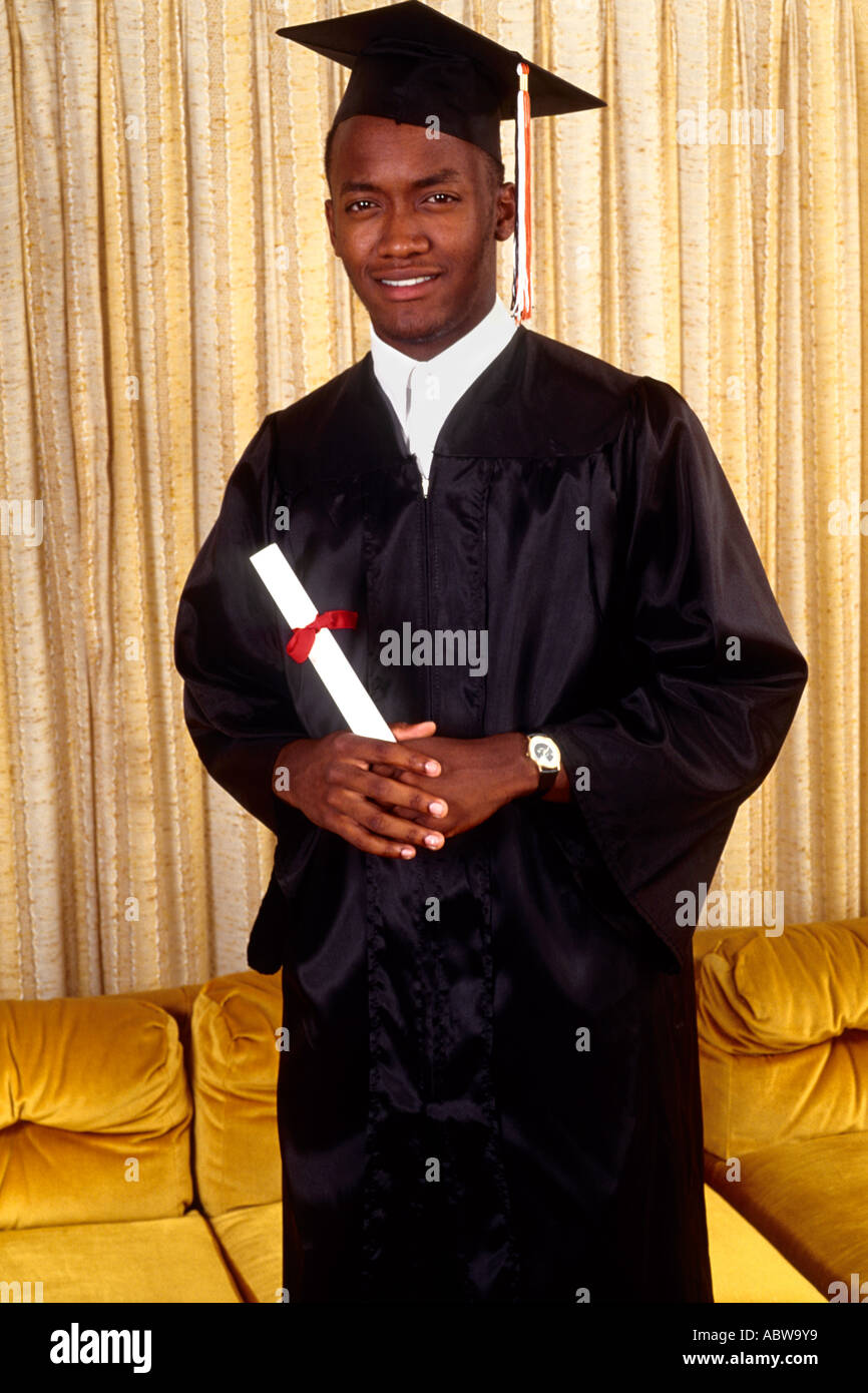 Black Student graduating from high school with celebration at home with ...