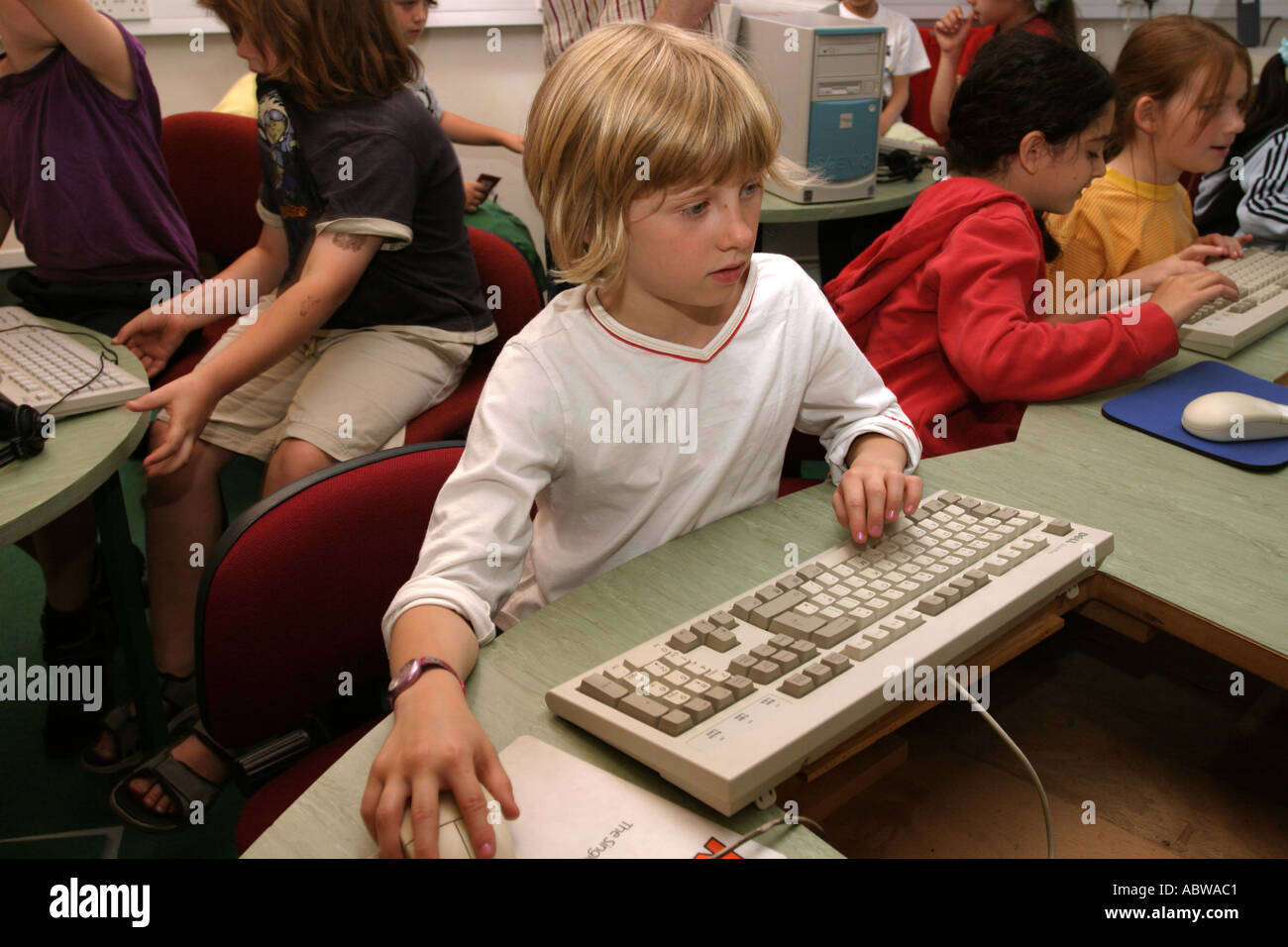 A young girl working on a computer in her school computer suite, Betty ...